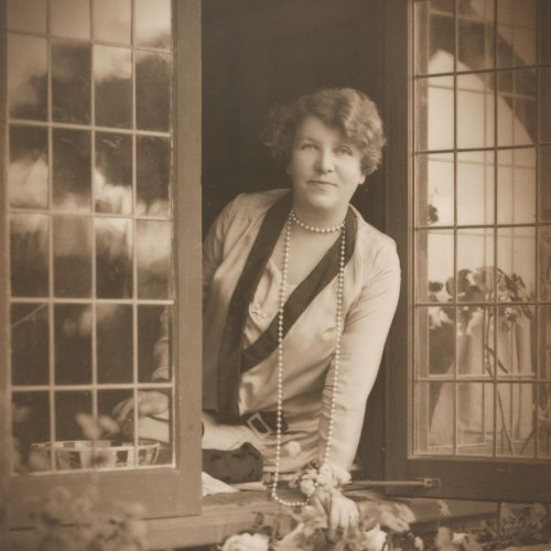 Rose Lindsay in garden at Springwood with Peter the fox terrier ...