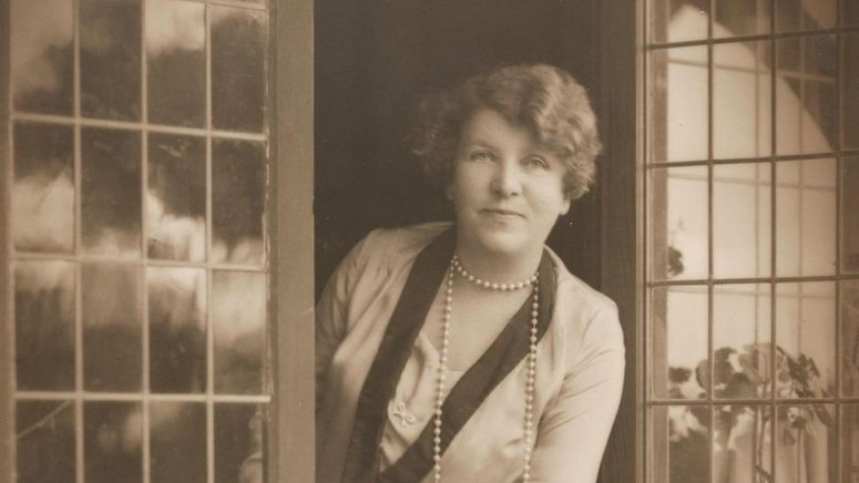 Rose Lindsay in garden at Springwood with Peter the fox terrier ...